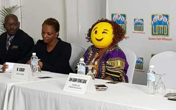 Multi-million jackpot winner collects cheque in emoji mask